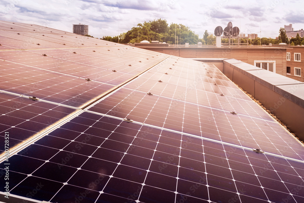 Solar Panel Roof Building on Skyscrapers Background with Sun Reflection ...