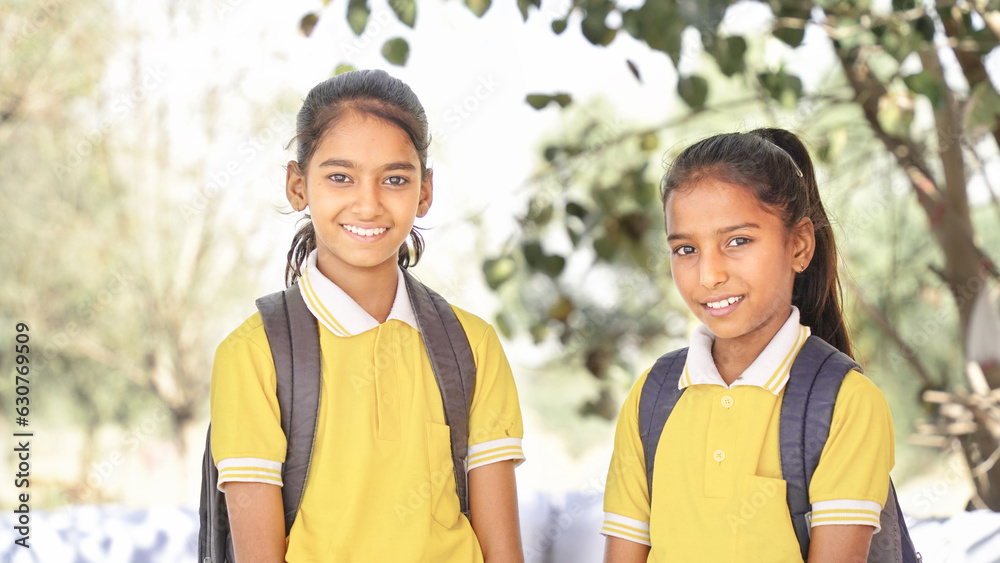 Happy Indian student schoolgirl wearing school uniform. closeup ...