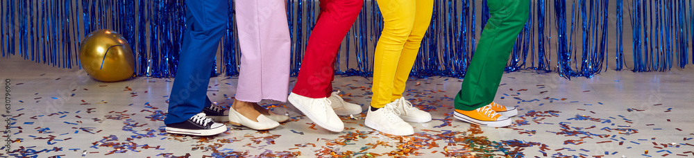 Group of five different happy young people in colorful pants dancing ...