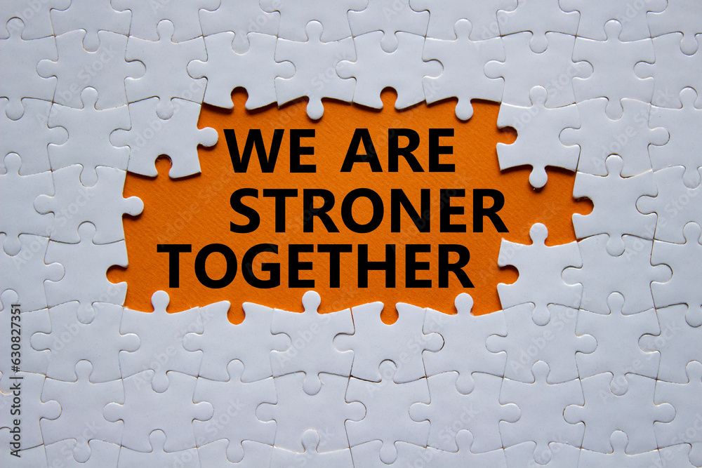 We are stronger together symbol. White puzzle with words We are ...
