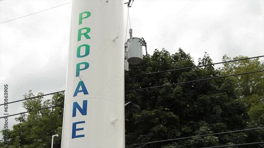 propane white vertical cylinder refill station with propane written on ...