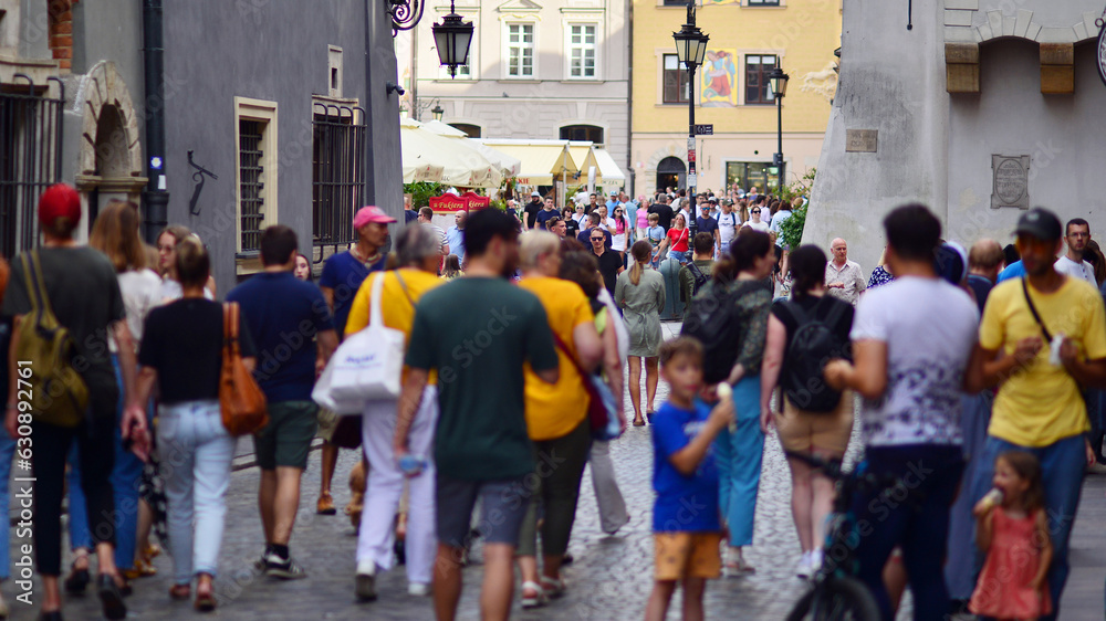 Warsaw, Poland. 29 July 2023. Crowd of people walking on a street. A ...