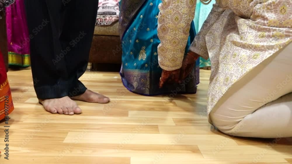 touching toe of parents in hindu ceremony. Namaskar for father and ...