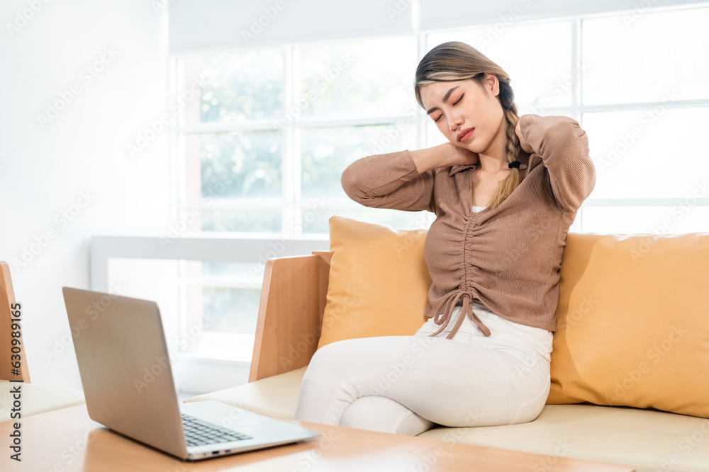 Office syndrome concept. Asian woman she experiences pain in neck and ...