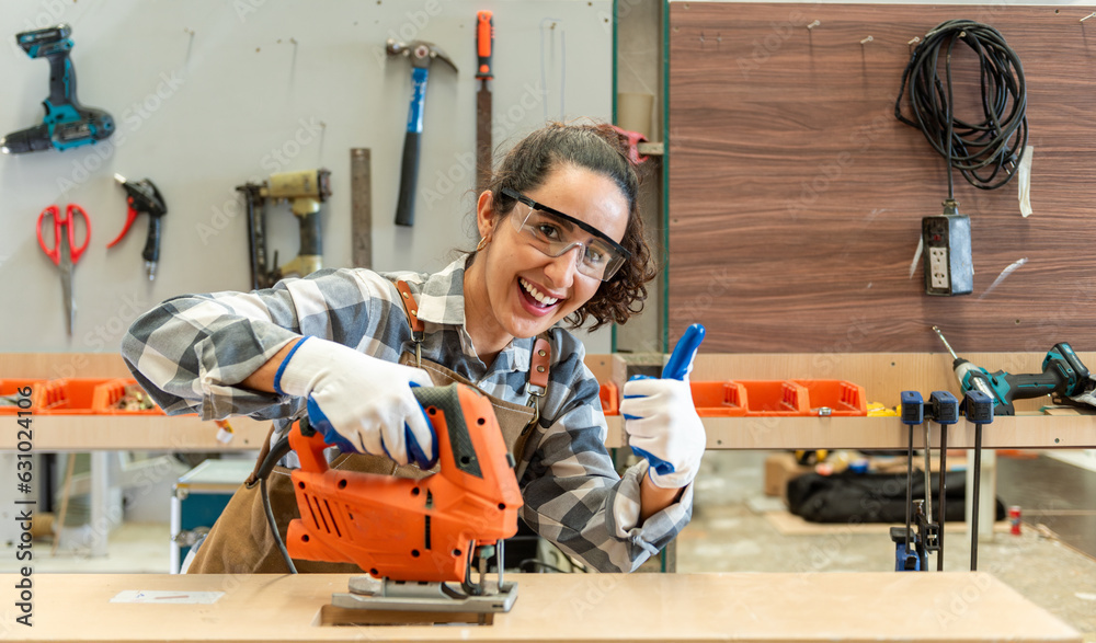 One Strong confident young aged women carpenter standing aim at wood ...