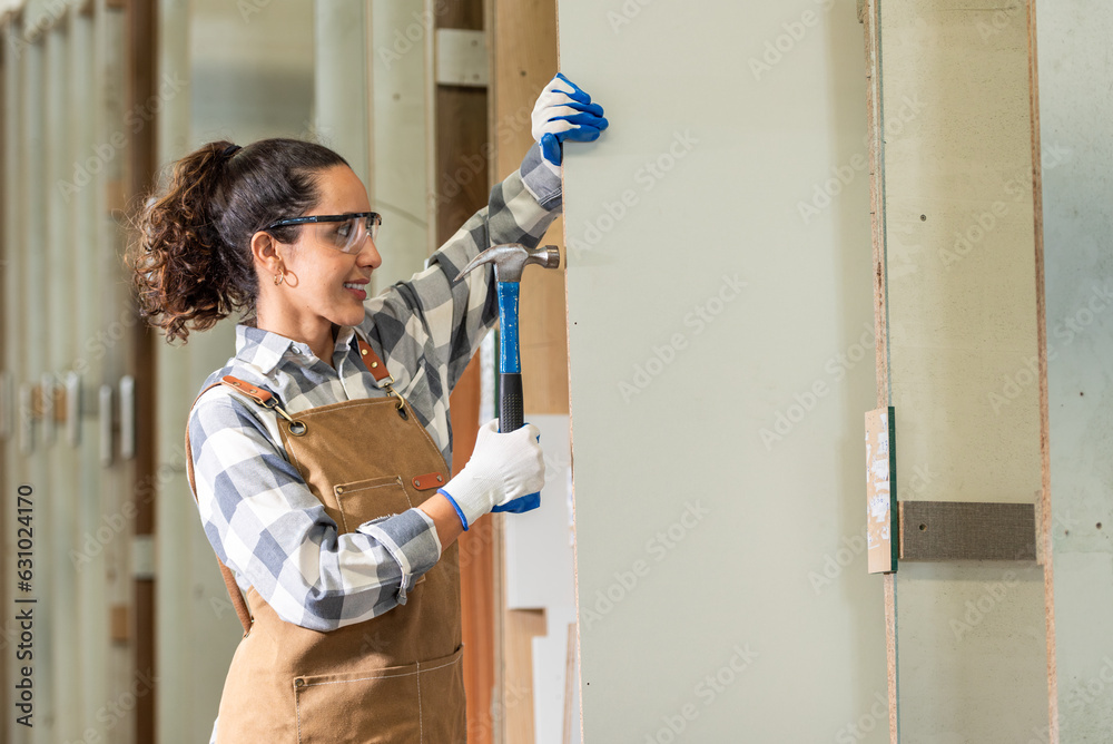 One Strong confident young aged women carpenter standing look at camera ...