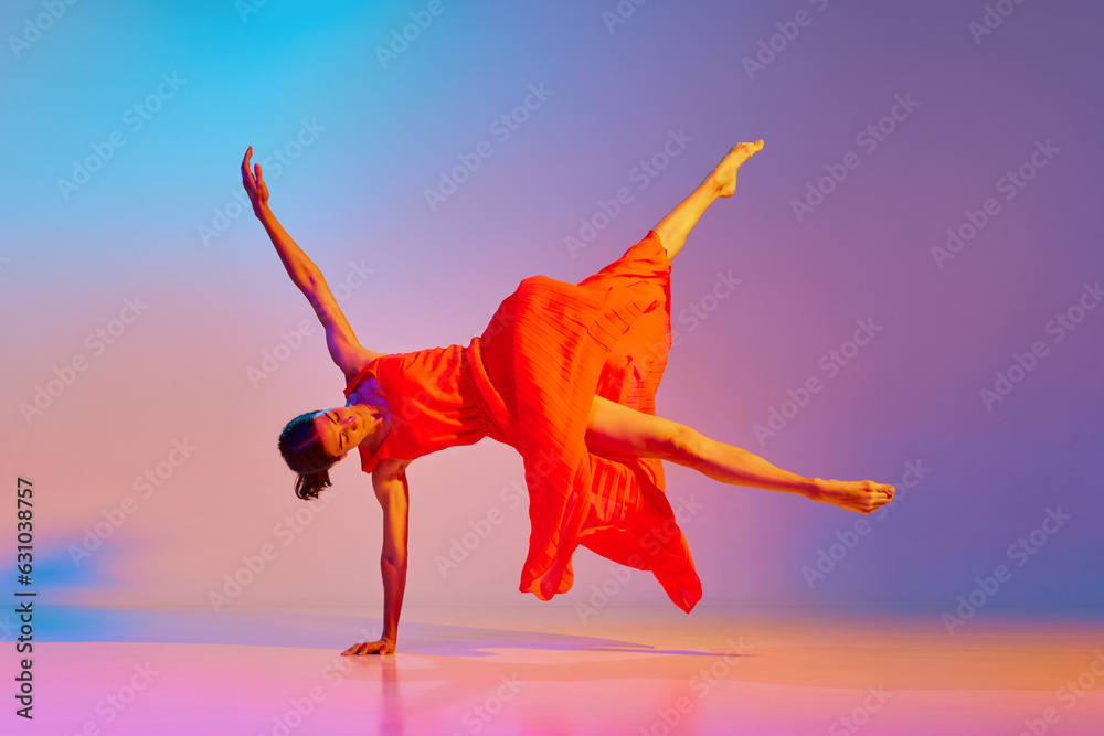 Classic and modern. Elegant young woman dancing contemp in dress ...