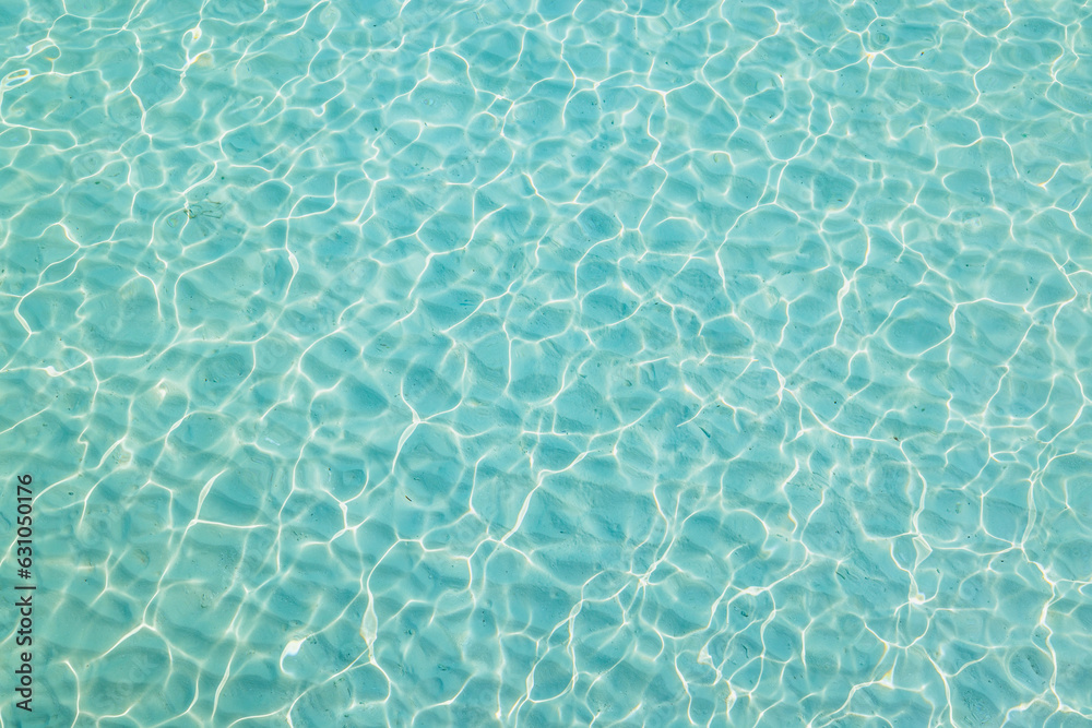 Water in swimming pool. Bright rippled water surface detail background ...