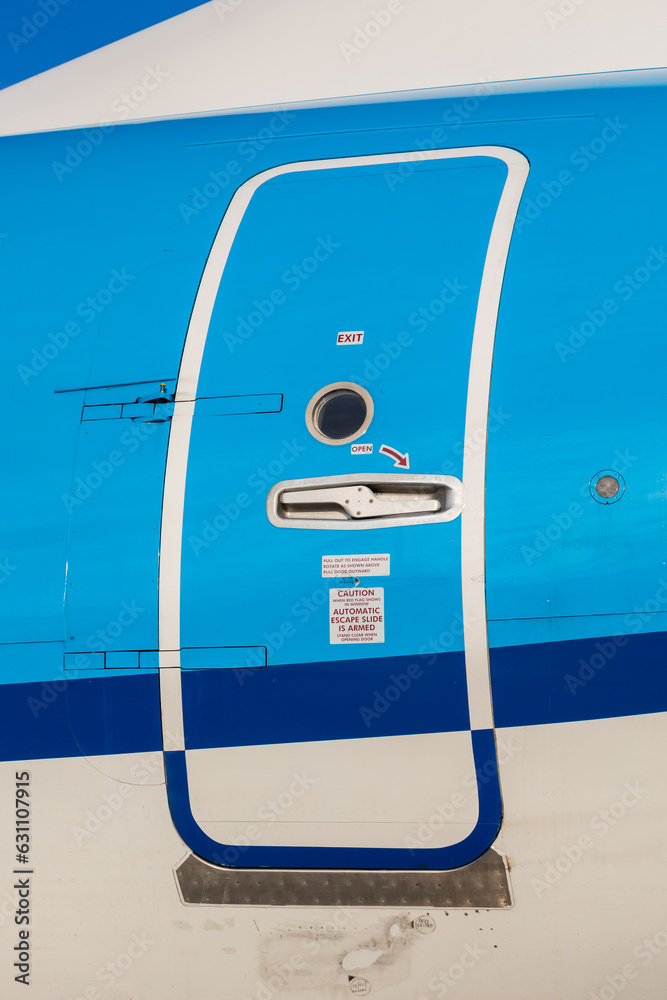 Exterior view of an airplane aft entry door, exit door, service door ...