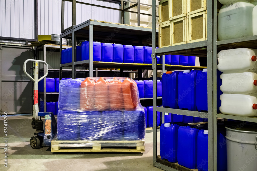Industrial interior of warehouse storage of chemical liquids on racks ...