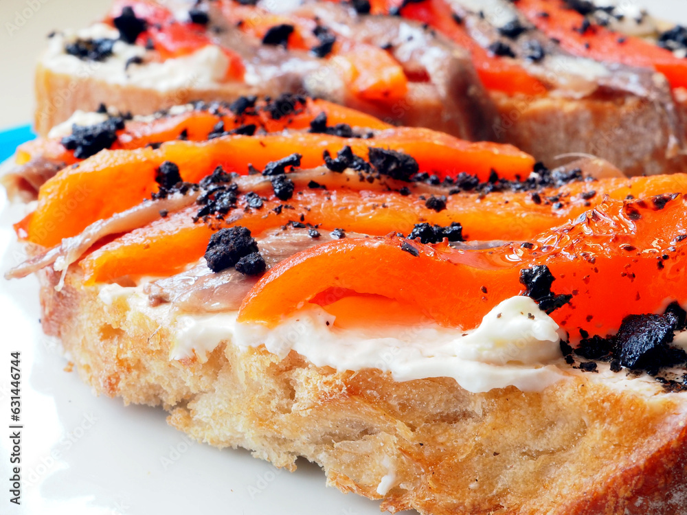 Toast tapas with anchovies, pepper, olives on bread Stock Photo | Adobe ...