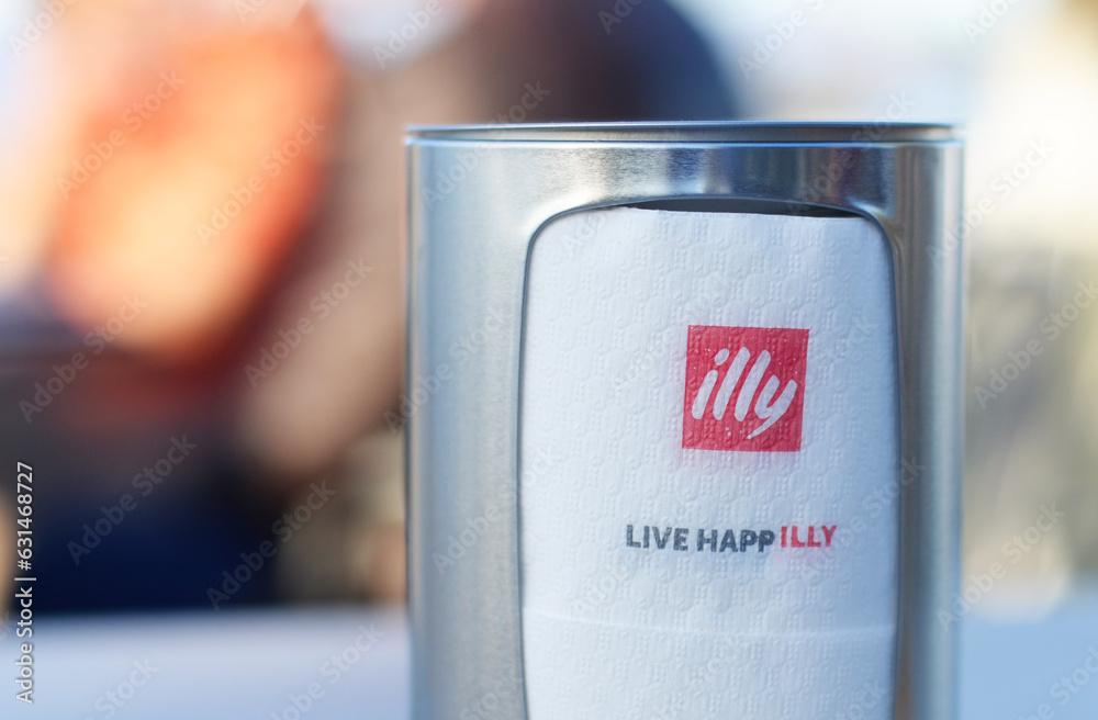 STRESA, ITALY – APRIL 14, 2023: Napkin holder with text 'Live HappILLY ...