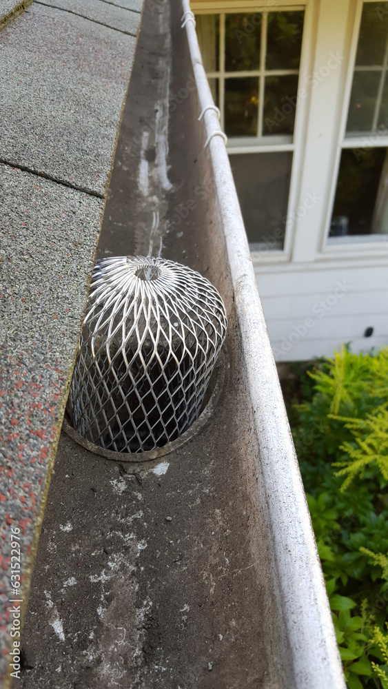 Rain Gutter Downspout Screens clean and clear gu is clogged with a ...