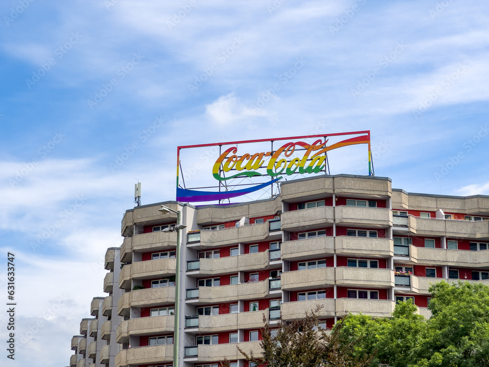 The Coca-Cola logo on the top of building in the colors of the flag of ...