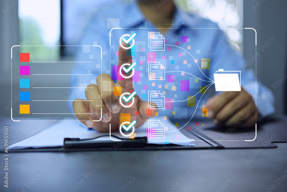 Businessman in office touch check mark to review and approve opened document from folder in ...