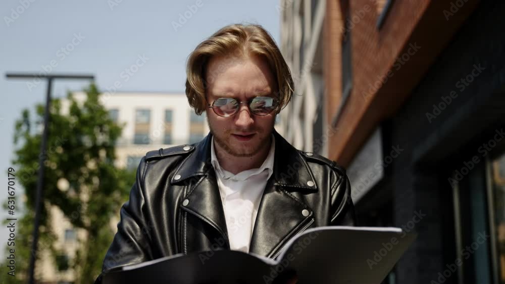 Studying the lesson before the lecture. A student with glasses looks at ...
