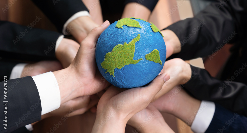 Top view business people holding Earth together in synergy as team ...