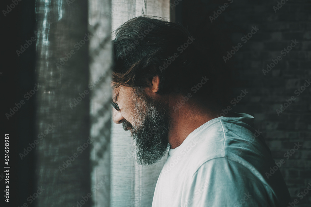 One lonely and depresse man with eyes closed stand up against the ...