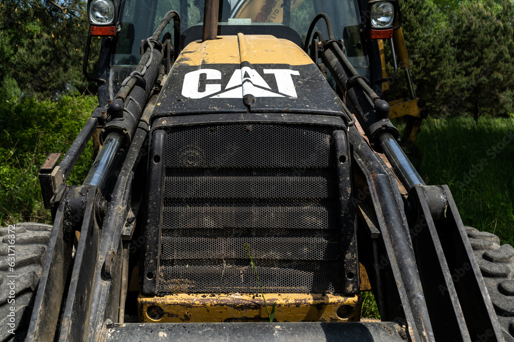 Foto de Cat Caterpillar backhoe loader at the construction site. Heavy ...
