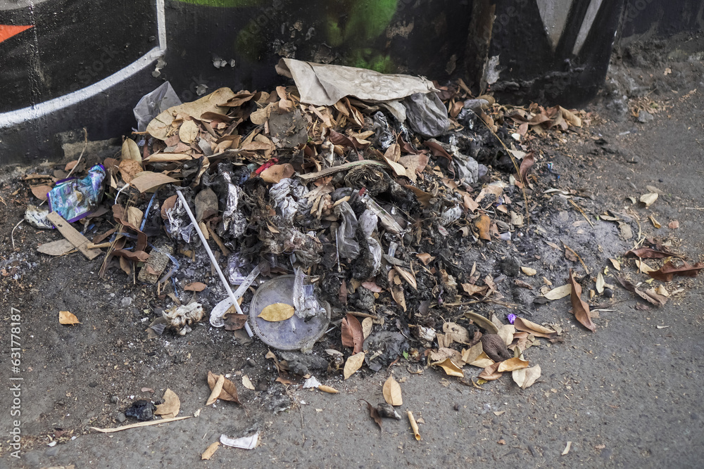 Piles of trash in bags that placed on the side of the road. Streets ...