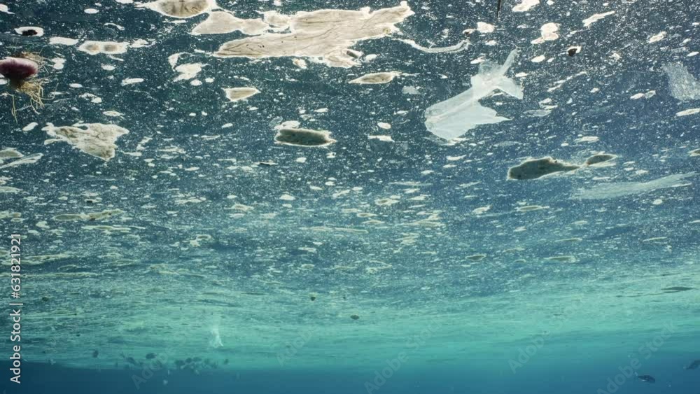 Polluted surface of ocean is covered with plastic and other waste ...