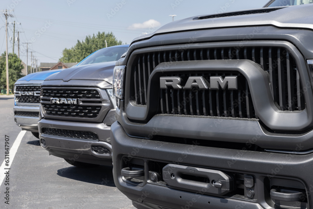 Ram 2500 and 1500 pickup truck display at a dealership. Stellantis ...