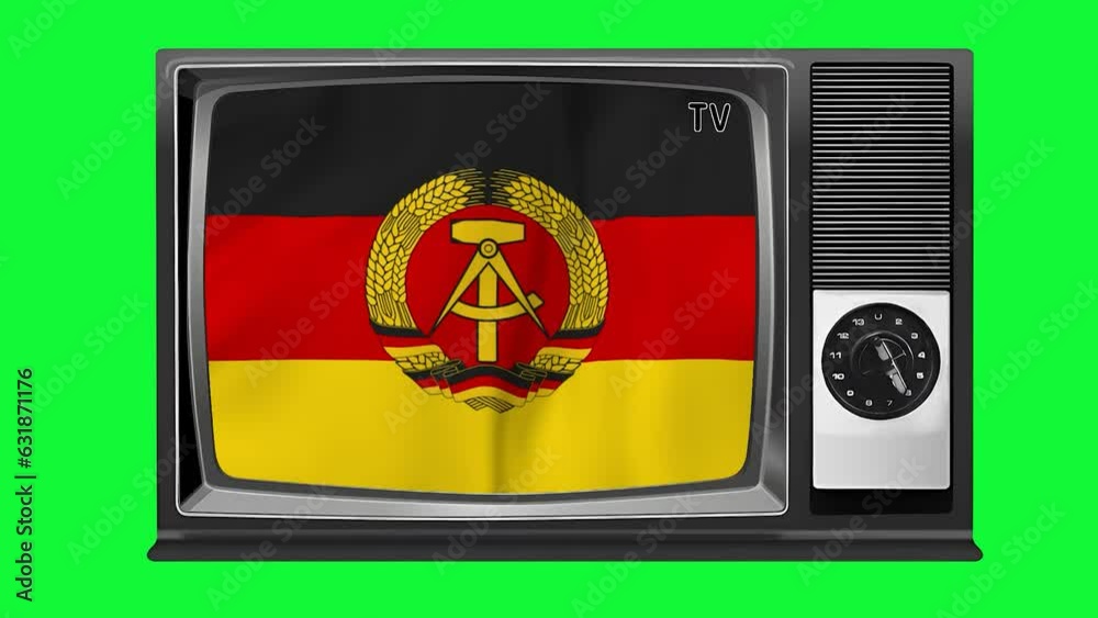 Waving flag of East Germany on the screen of an old TV set, isolated in ...