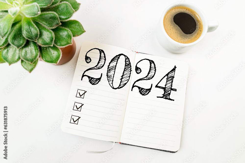 New year resolutions 2024 on white desk. 2024 resolutions list with ...