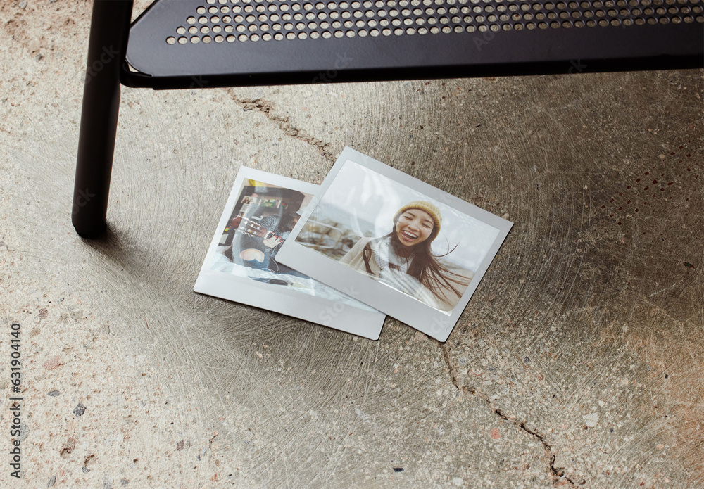 Mockup of two customizable instant camera photo prints on floor ...