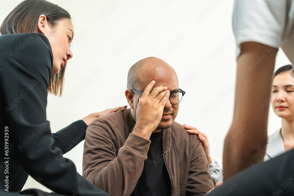 Group therapy session. Crying asian man feel pain upset depression talk ...