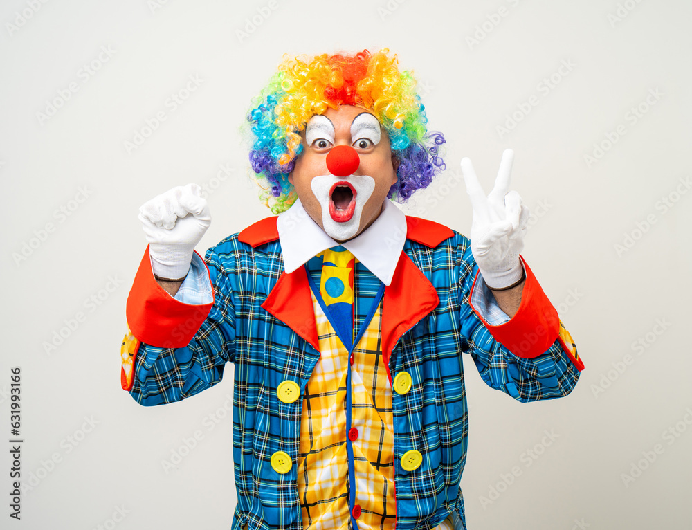 Mr Clown. Portrait of Funny face Clown man in colorful uniform standing ...
