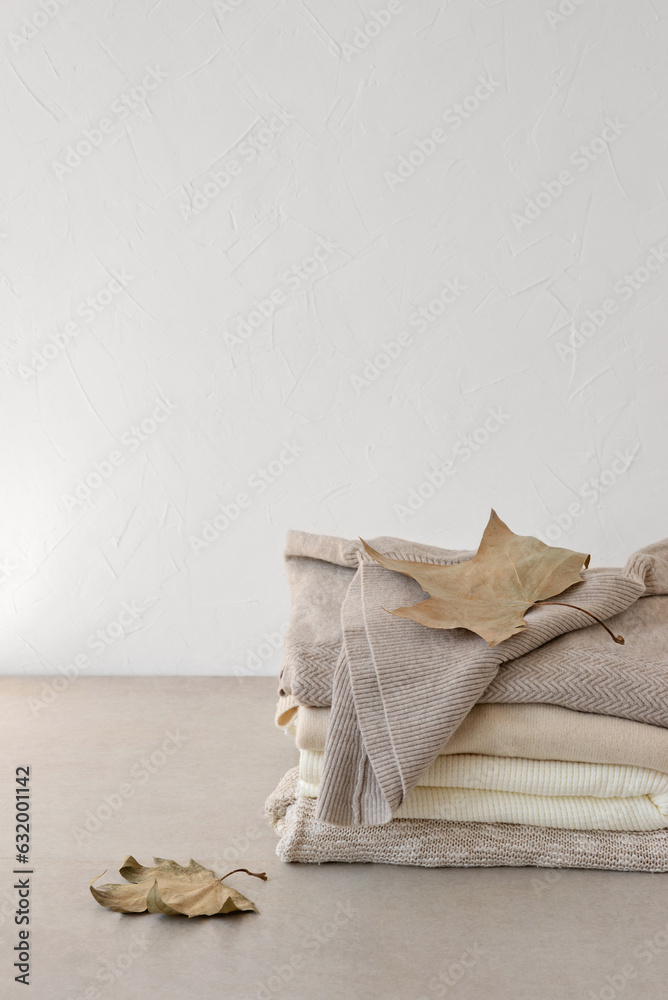 Neutral beige pastel wool, cashmere and cotton sweaters stack with ...