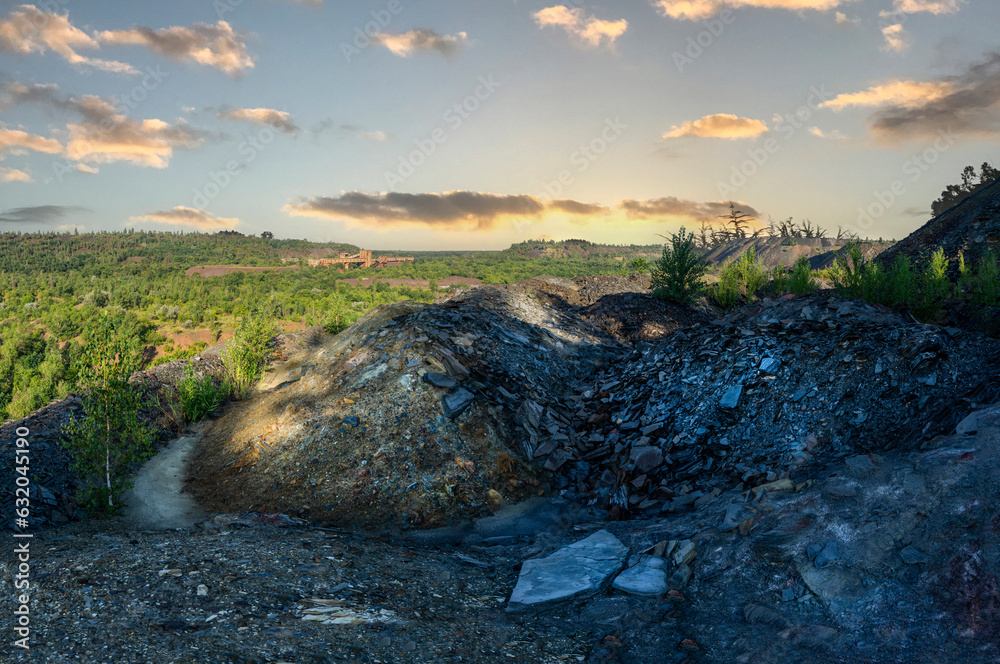 Stones and empty rock that remained after the extraction of iron ore in ...