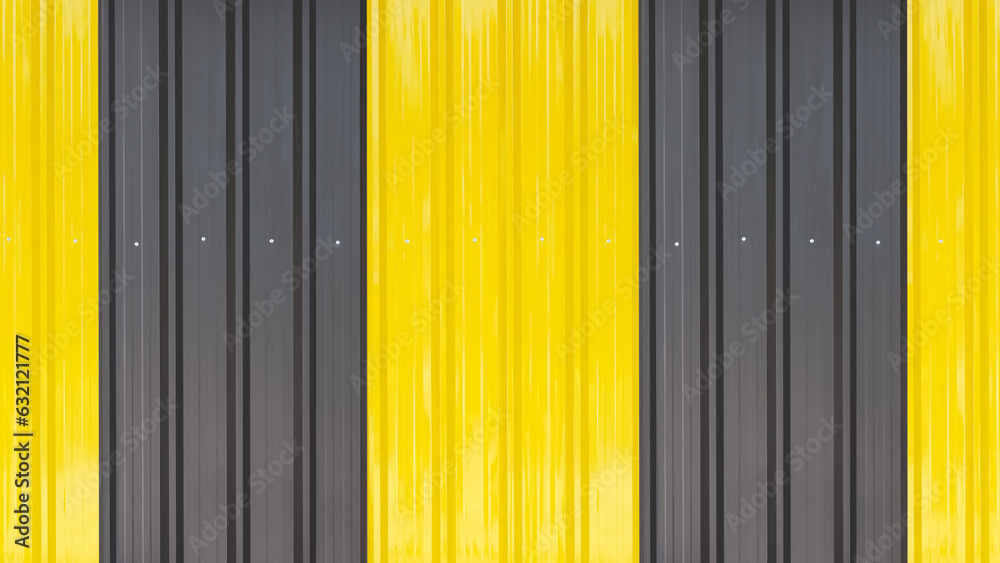 Yellow and black alternately colors pattern of corrugated steel wall ...