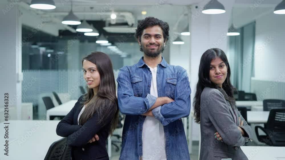 Three young happy Asian Indian intern male and female office employees ...