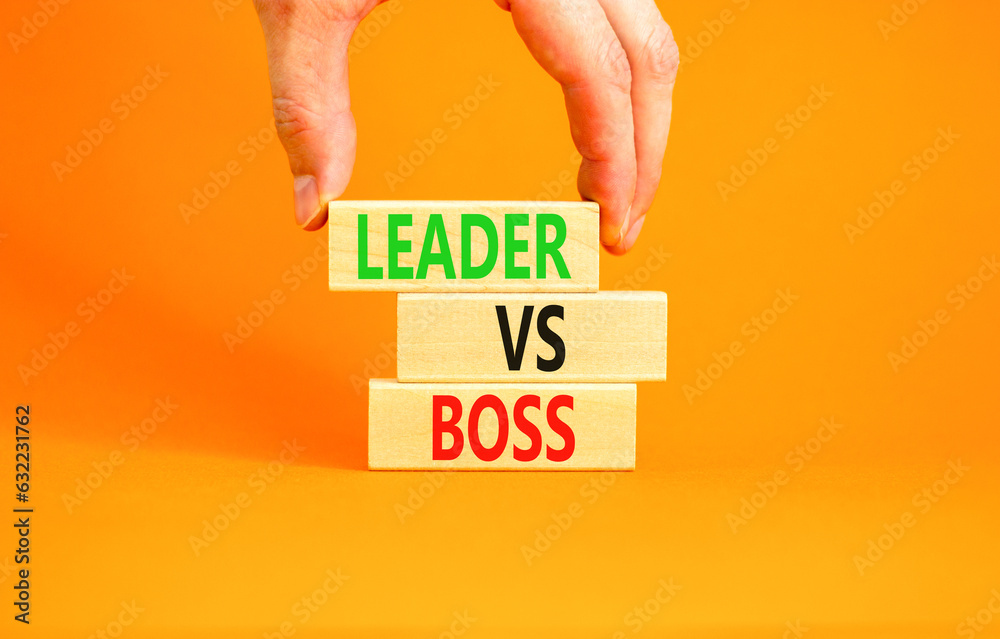 Boss vs leader symbol. Concept words Boss vs versus leader on wooden ...