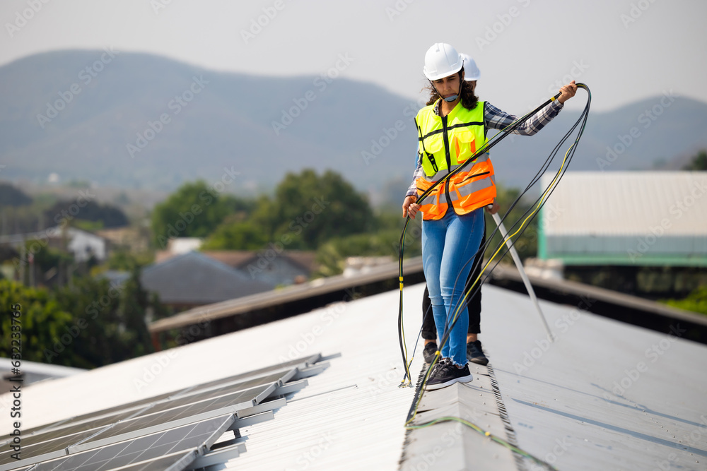Electrician pulling wire into PVC pipe electrical engineering female ...