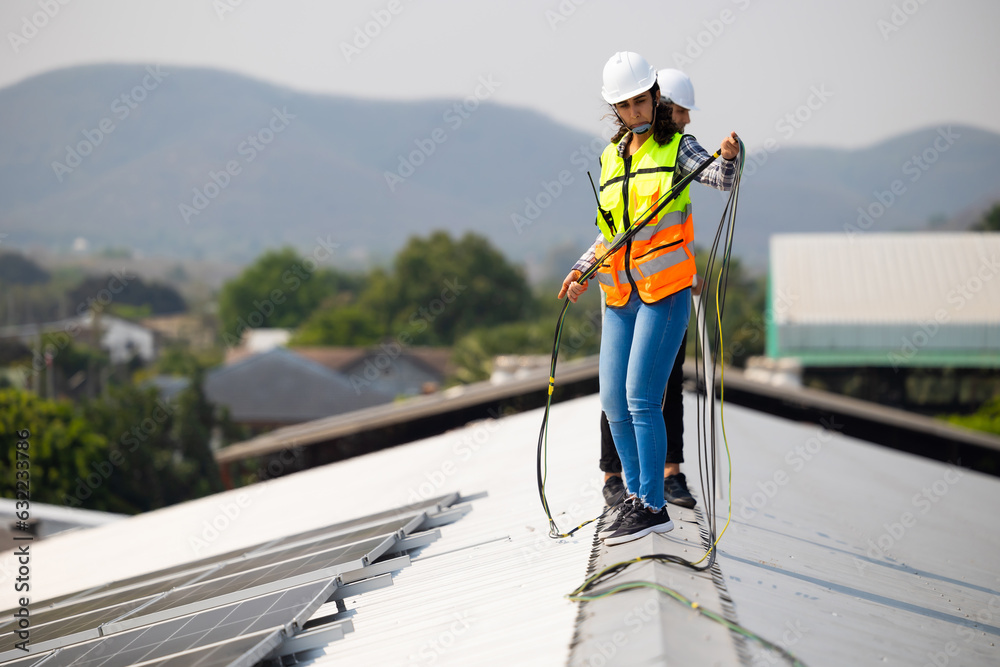 Electrician pulling wire into PVC pipe electrical engineering female ...