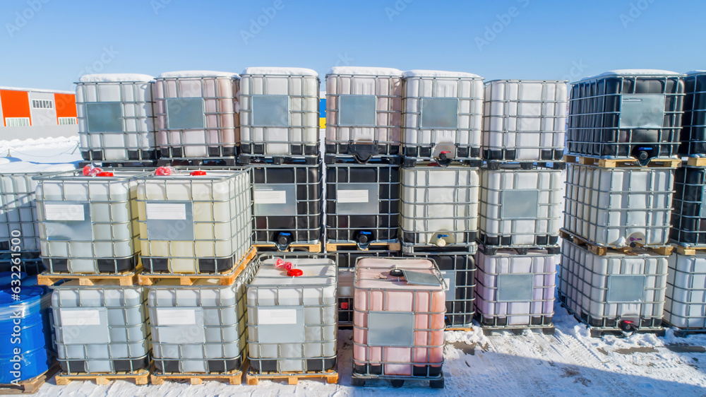 Industrial tanks for liquids. Plastic tanks on pallets. Barrels for ...
