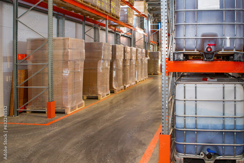 Logistic warehouse. Tanks and boxes on flights. Warehouse with multi ...