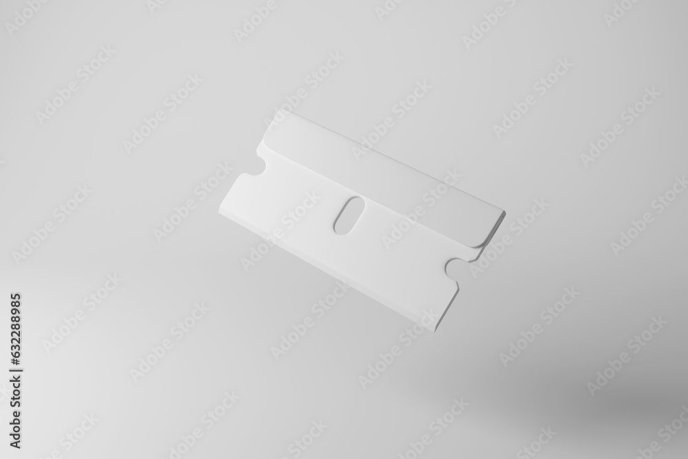 White razor blade floating in mid air on white background in monochrome ...