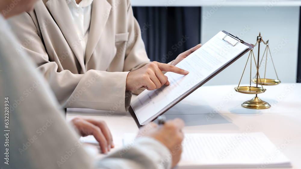 Labor law concept. Lawyer signing legal document with Judges gavel ...