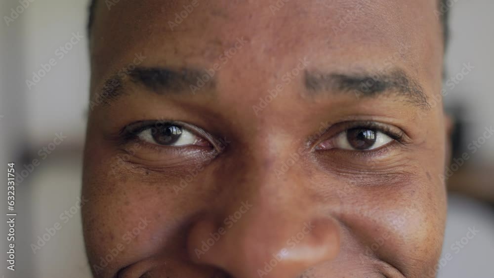 Very detailed portrait of a young black man looking into the camera ...