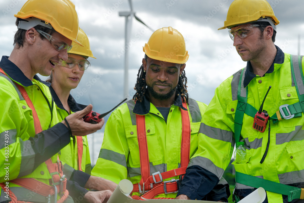 Smart professional engineers working in fieldwork outdoor. Workers ...