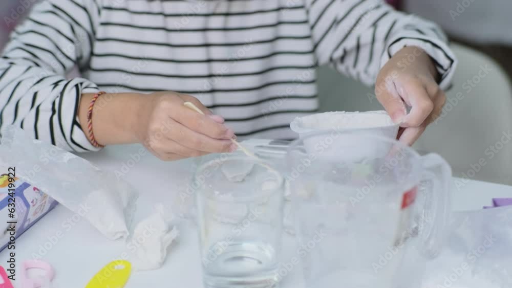 Cute little girl making DIY plaster and painting at home. Children ...