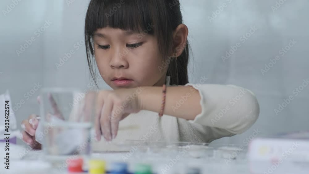 Cute little girl making DIY plaster and painting at home. Children ...