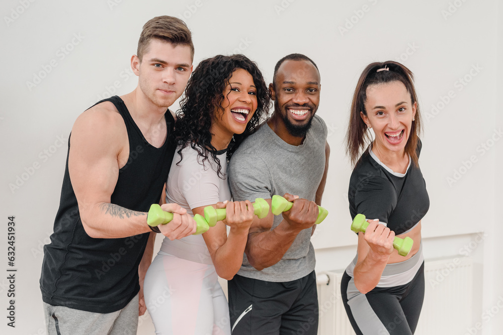 Group of young cheerful multinational people having fun and lifting ...