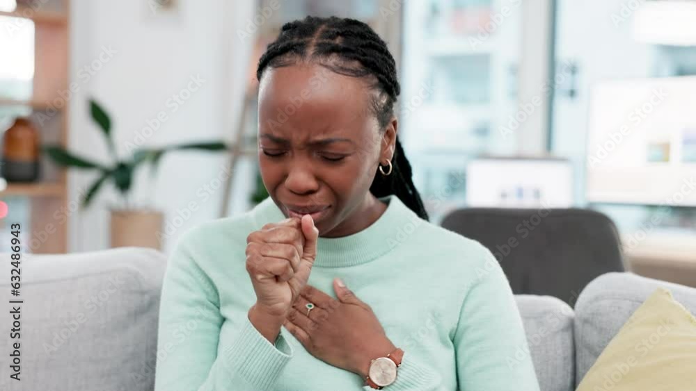 Cough, sick and black woman on a sofa with sore throat, flu or viral ...