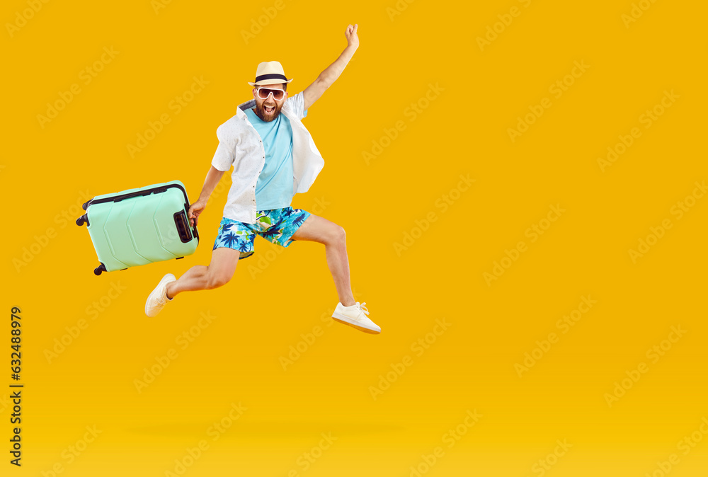 Happy excited man in summer clothes, holding suitcase, hurrying to ...