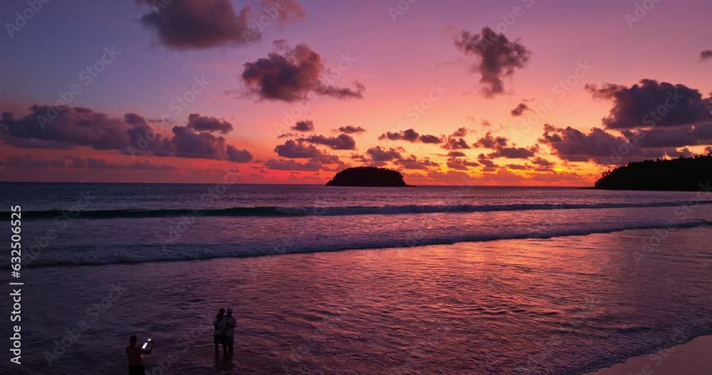 amazing bright red sky at stunning sunset..Wave after wave swept ...